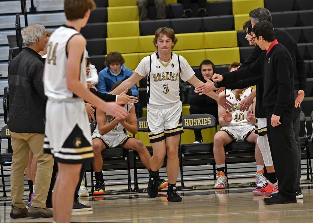 Prep notebook: Huskies defeat Tigers in boys basketball, Saints ...